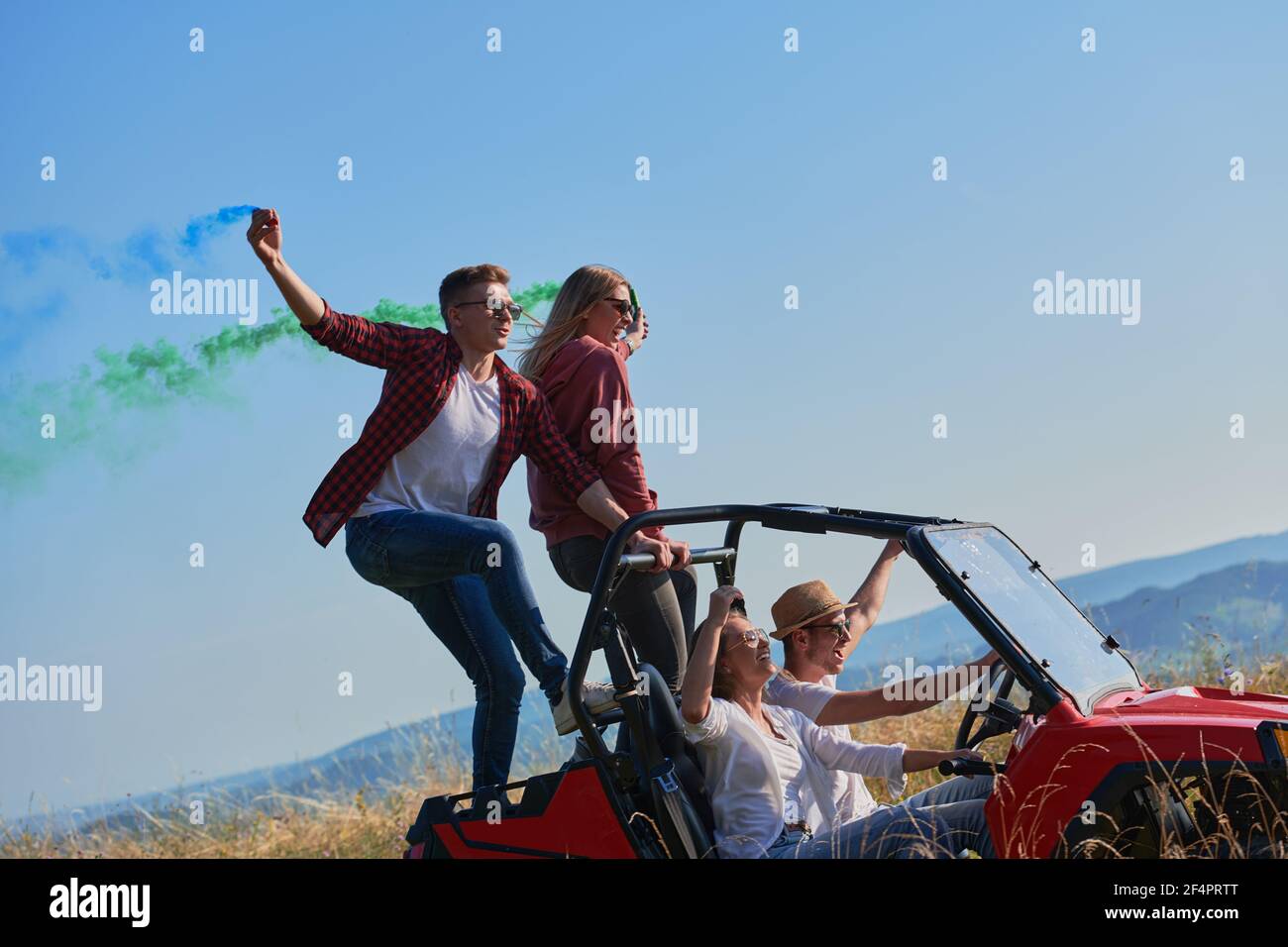 colorful torches while driving a off road buggy car Stock Photo - Alamy