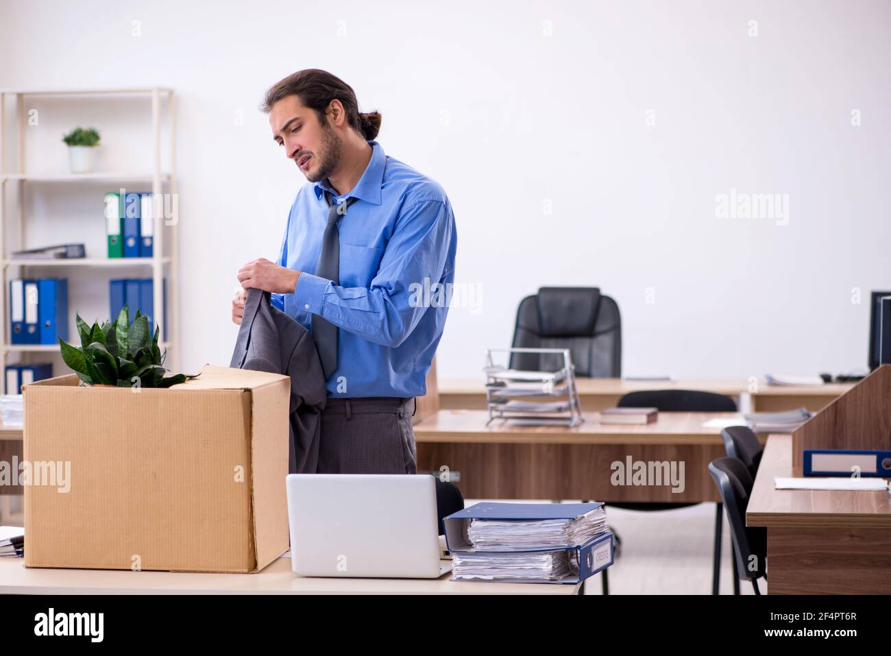 Young employee being fired from his work Stock Photo - Alamy