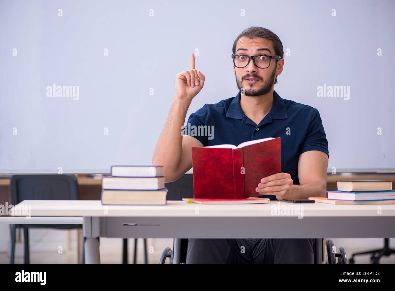 Young handicapped student in the classroom Stock Photo - Alamy