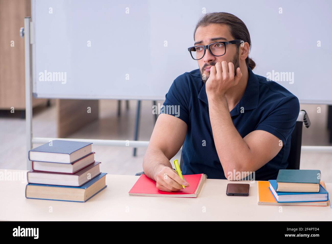 Young handicapped student in the classroom Stock Photo - Alamy