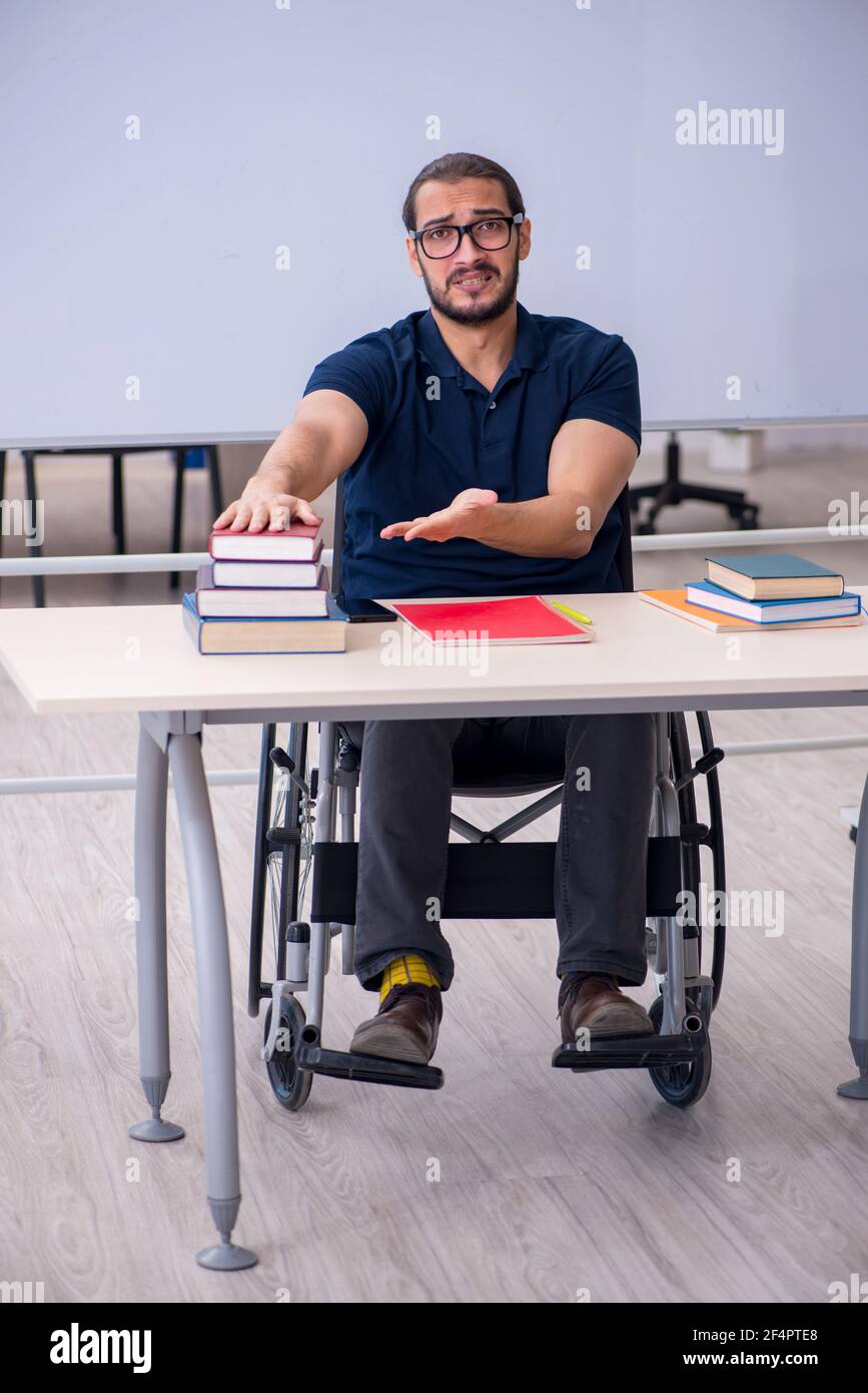 Young handicapped student in the classroom Stock Photo - Alamy