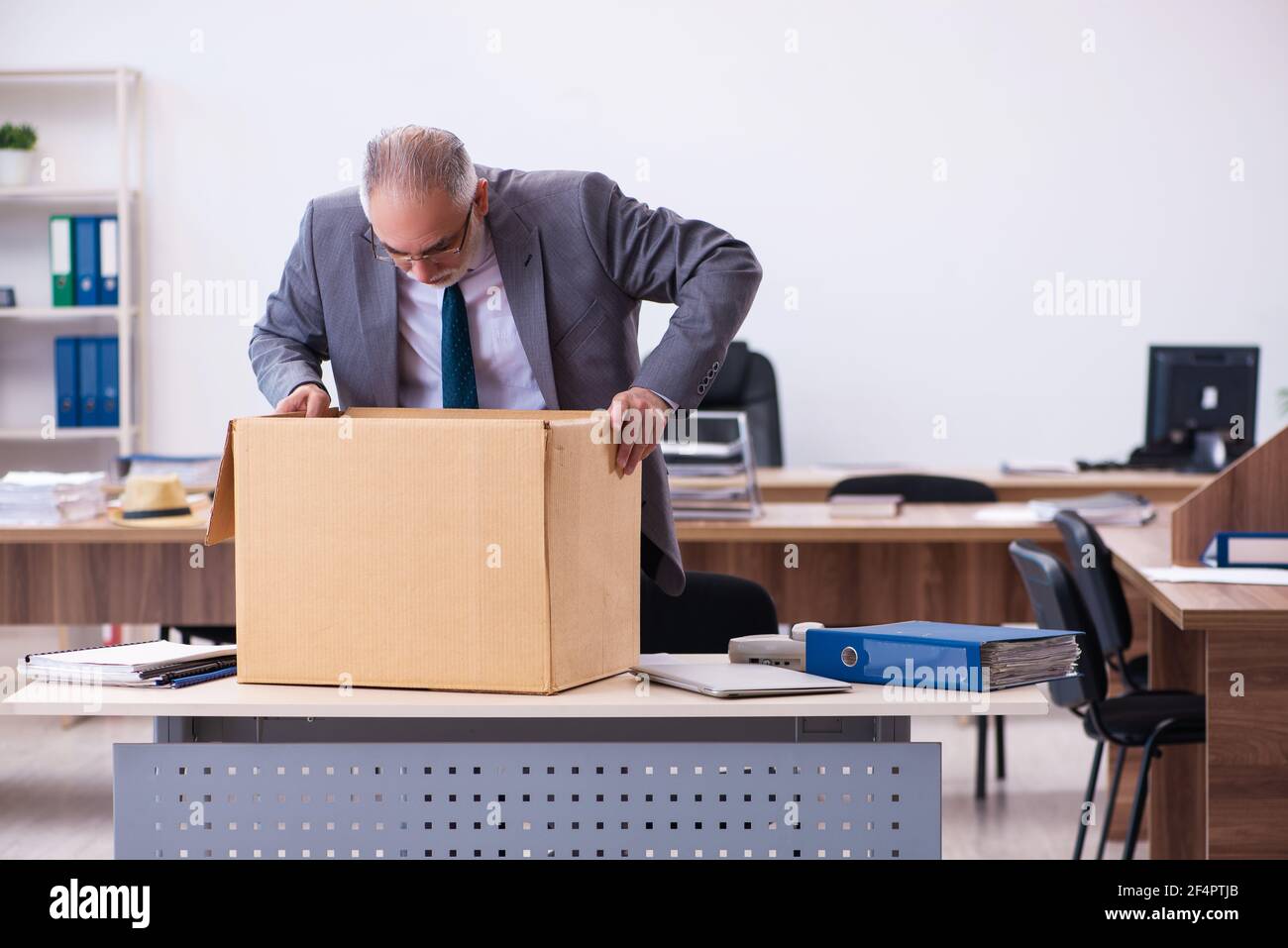 Old employee being fired from his work Stock Photo - Alamy