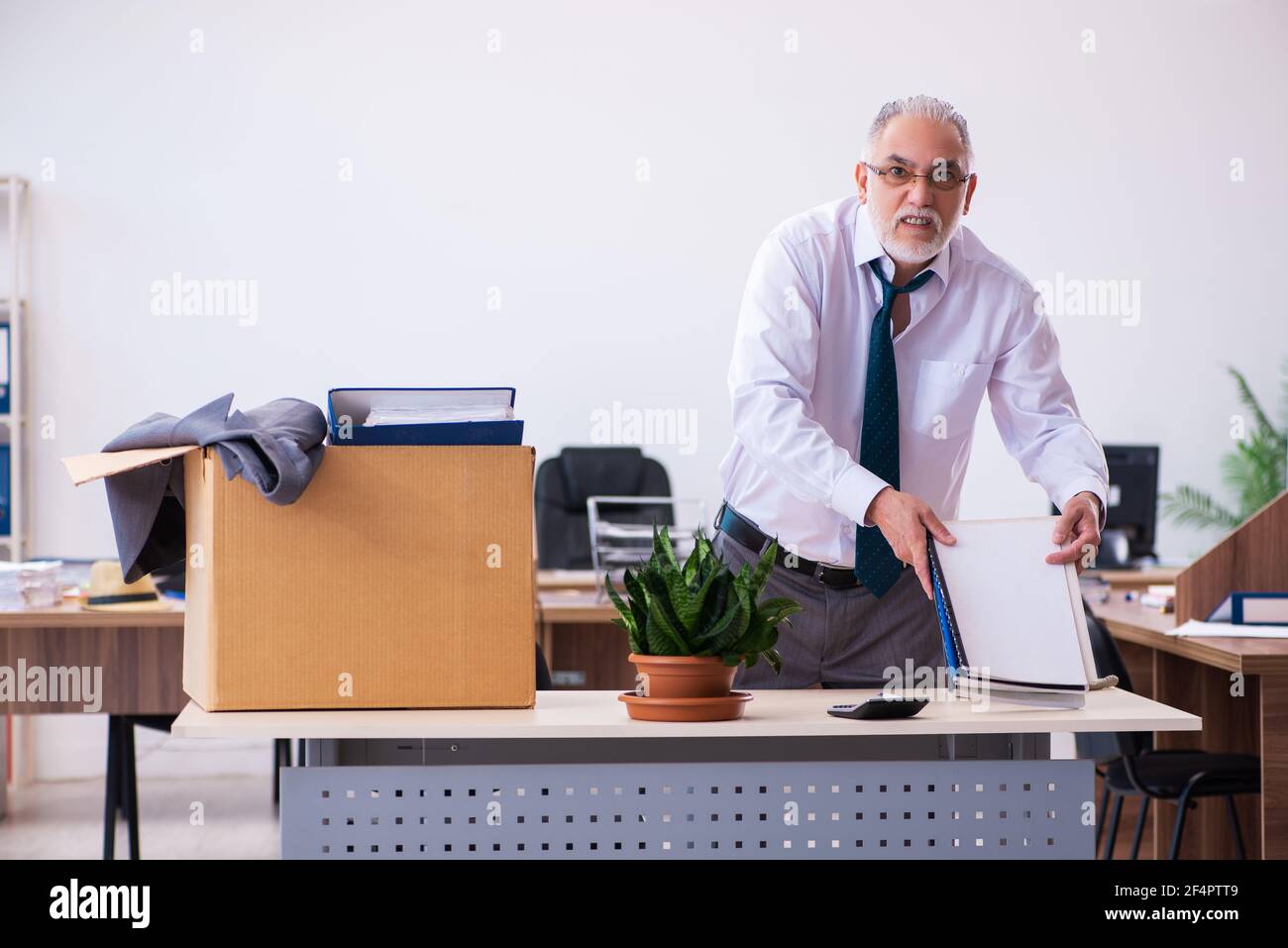 Old employee being fired hi-res stock photography and images - Alamy