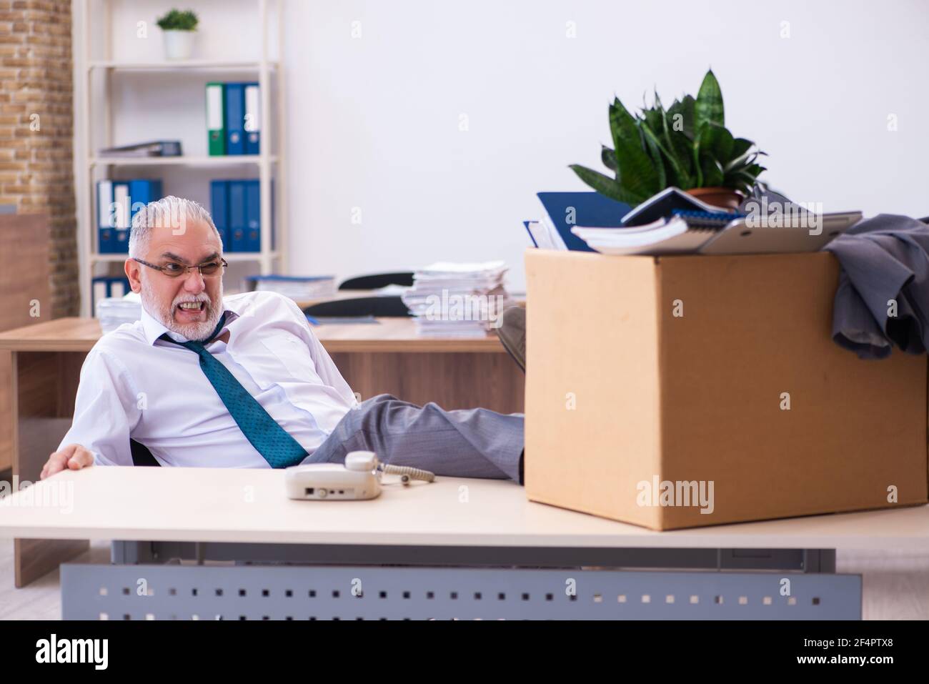 Old employee being fired from his work Stock Photo - Alamy