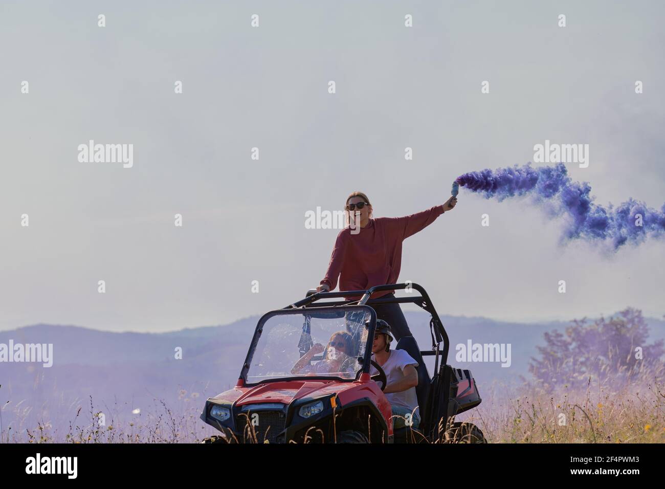 colorful torches while driving a off road buggy car Stock Photo - Alamy