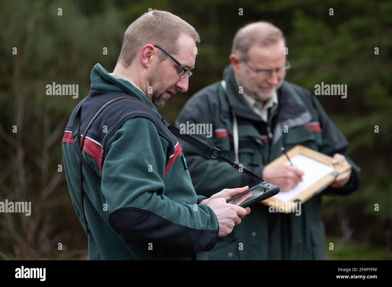 Belm, Germany. 16th Mar, 2021. Forester Sven Gerling (l) and retired ...