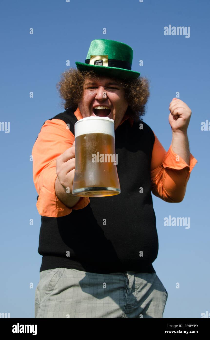 Funny fat guy is drinking beer Stock Photo - Alamy