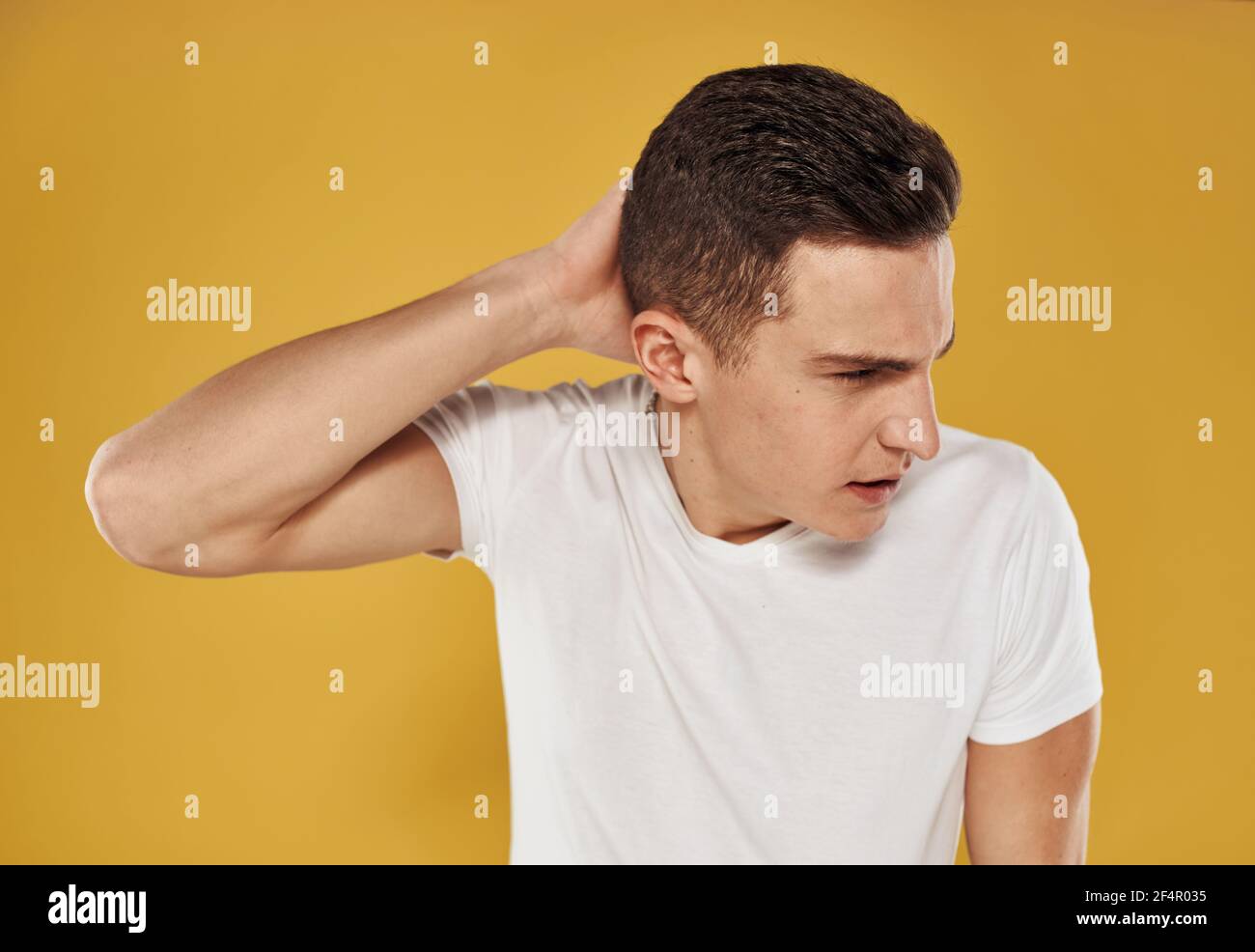 Angry man on a yellow background cry of emotion and stress Stock Photo ...