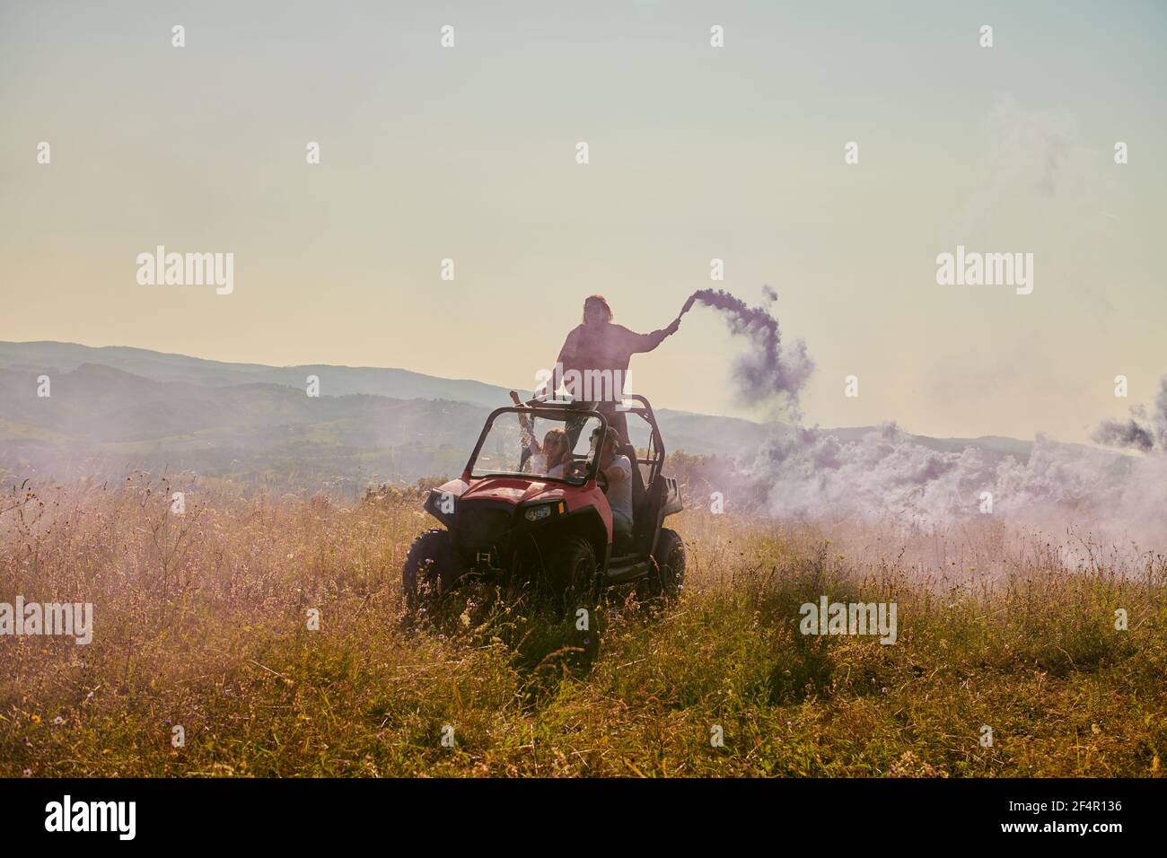 colorful torches while driving a off road buggy car Stock Photo - Alamy