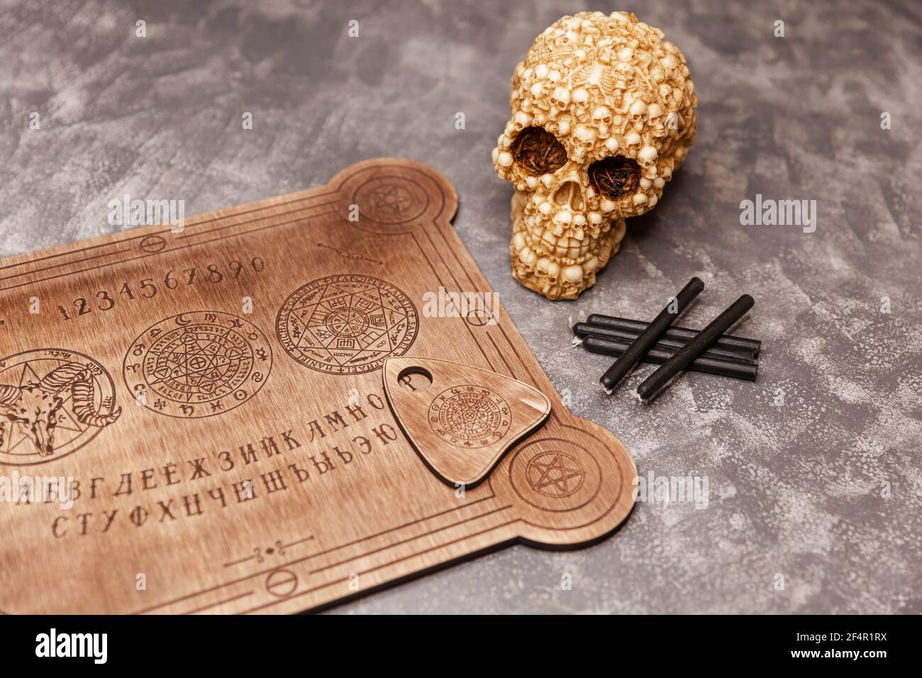 Talking spirit board and a skull. Ouija Board. Fortune teller Stock ...