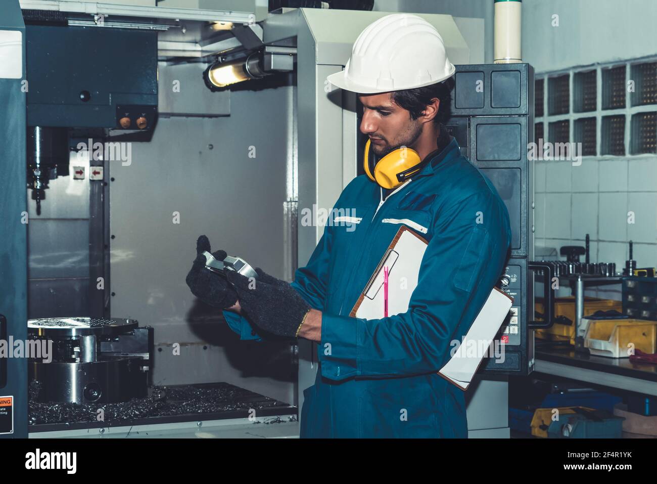 Smart factory worker or engineer do machine job in manufacturing ...