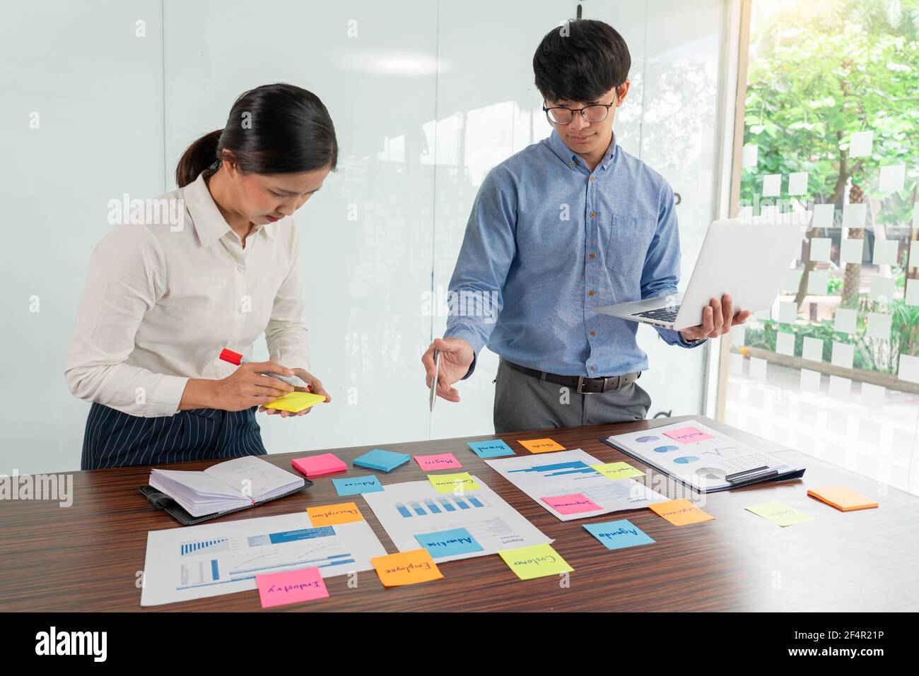 Creative group of business people brainstorming use sticky notes ...