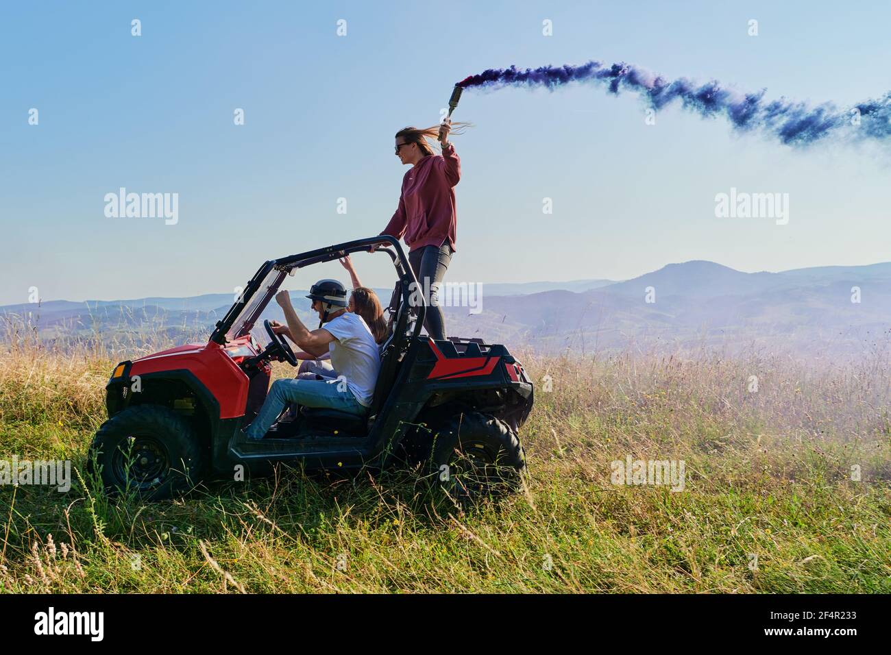 colorful torches while driving a off road buggy car Stock Photo - Alamy