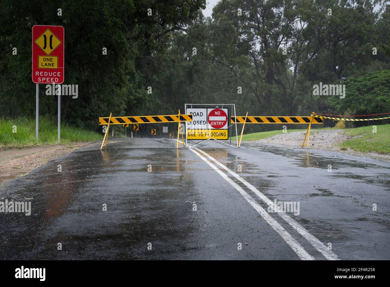 Sign warning of the road ahead being closed due to flooding Stock Photo ...