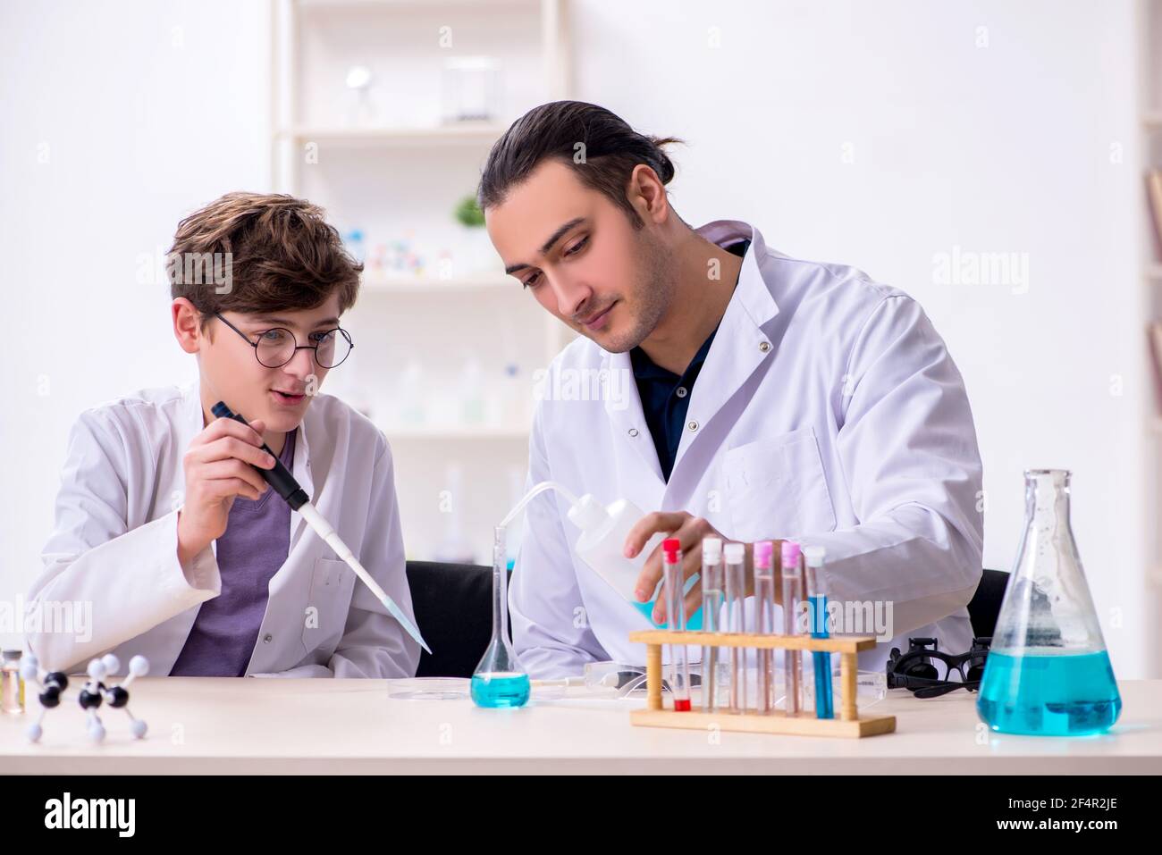 Young father and son chemists in the laboratory Stock Photo - Alamy