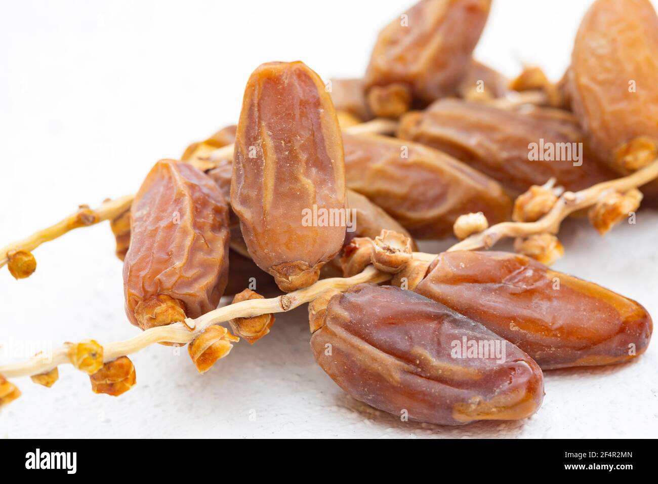 dried dates isolated on white background Stock Photo - Alamy