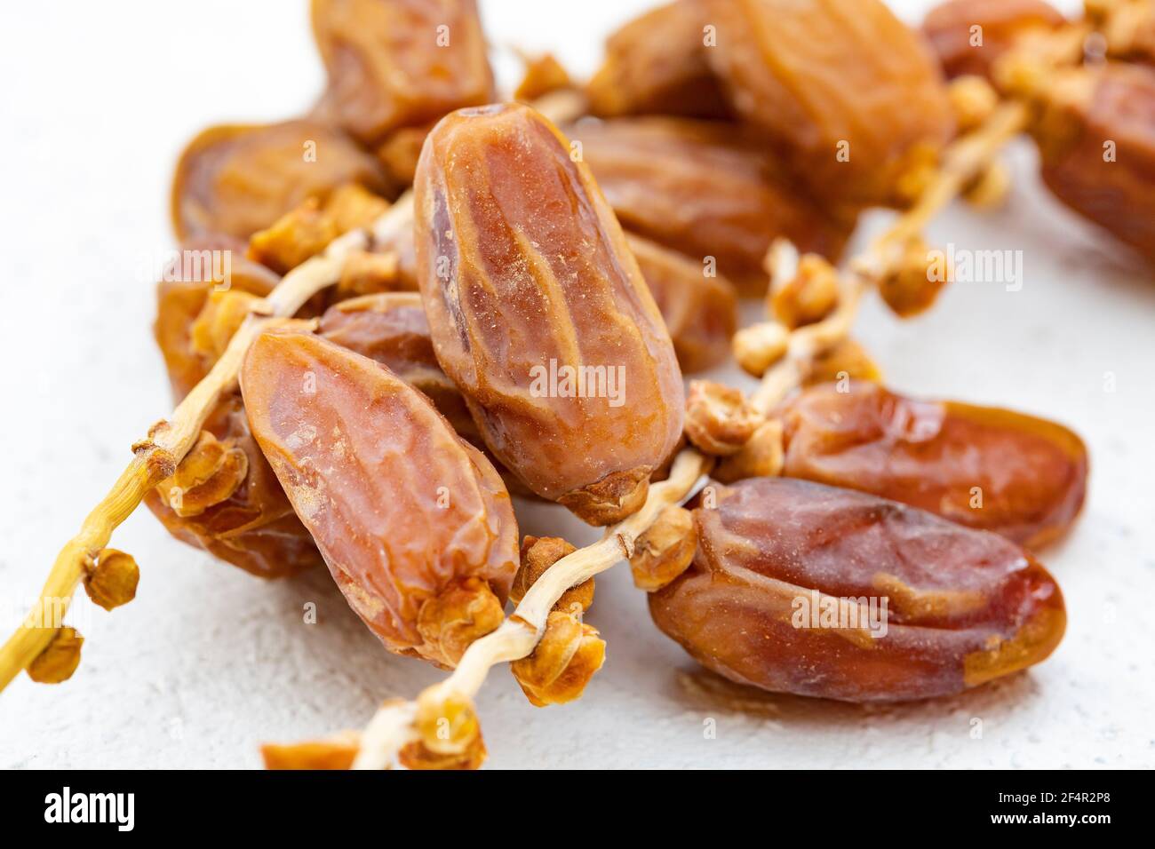 dried dates isolated on white background Stock Photo - Alamy