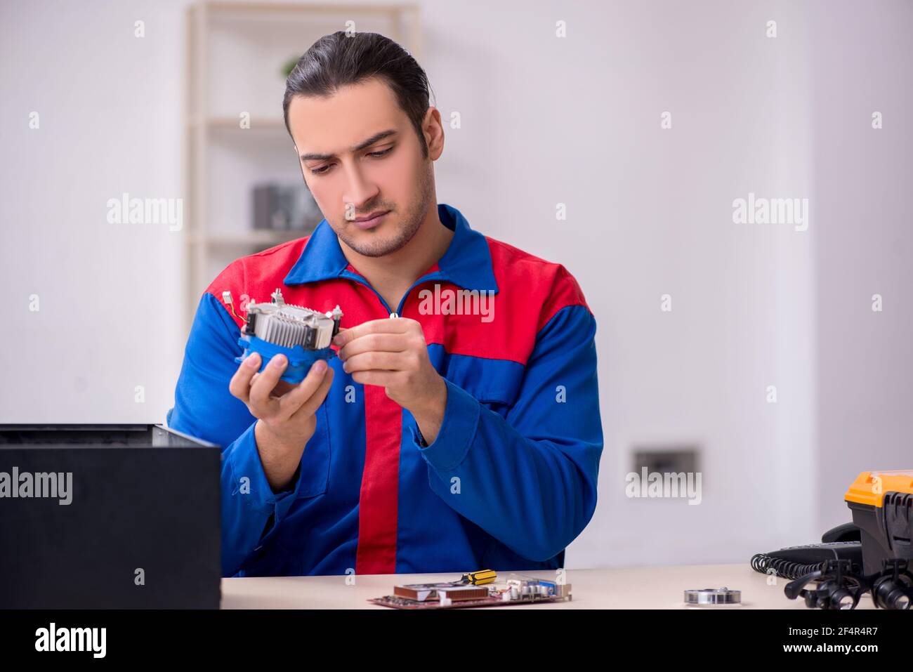 Man repairing device cooling hi-res stock photography and images - Alamy