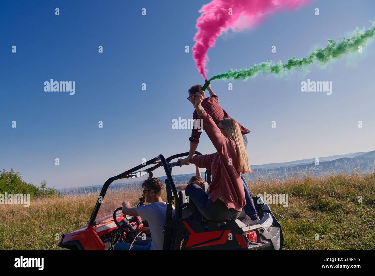 colorful torches while driving a off road buggy car Stock Photo - Alamy