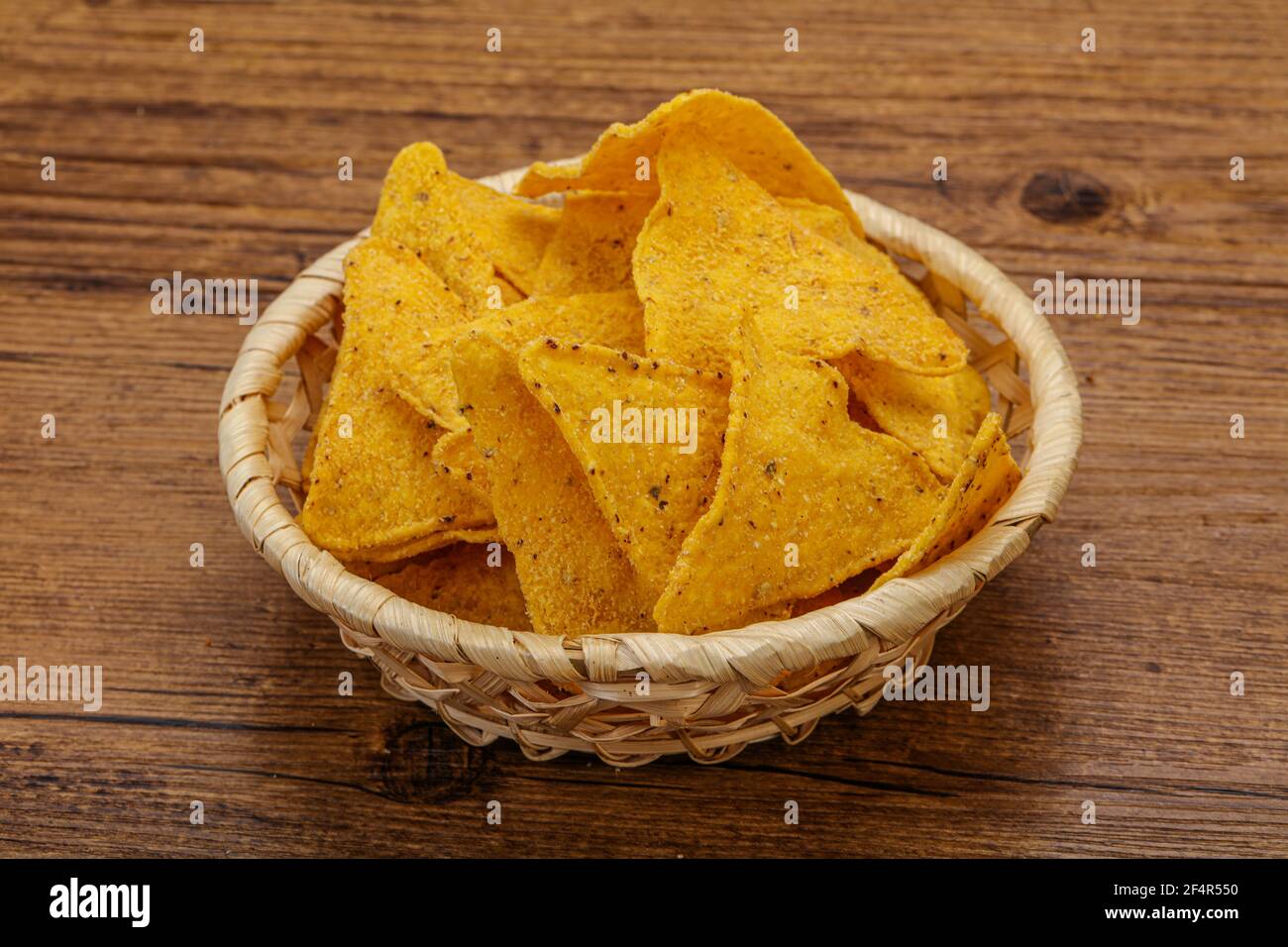 Mexican crunchy corn nachos triangle heap Stock Photo - Alamy