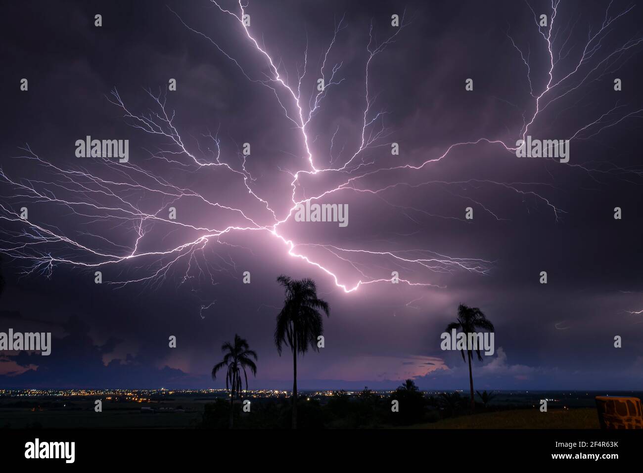 Lightning covers the sky during a tropical storm Stock Photo - Alamy