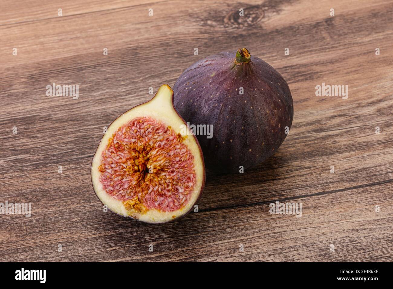 Sweet purple slice of fig fruit Stock Photo - Alamy