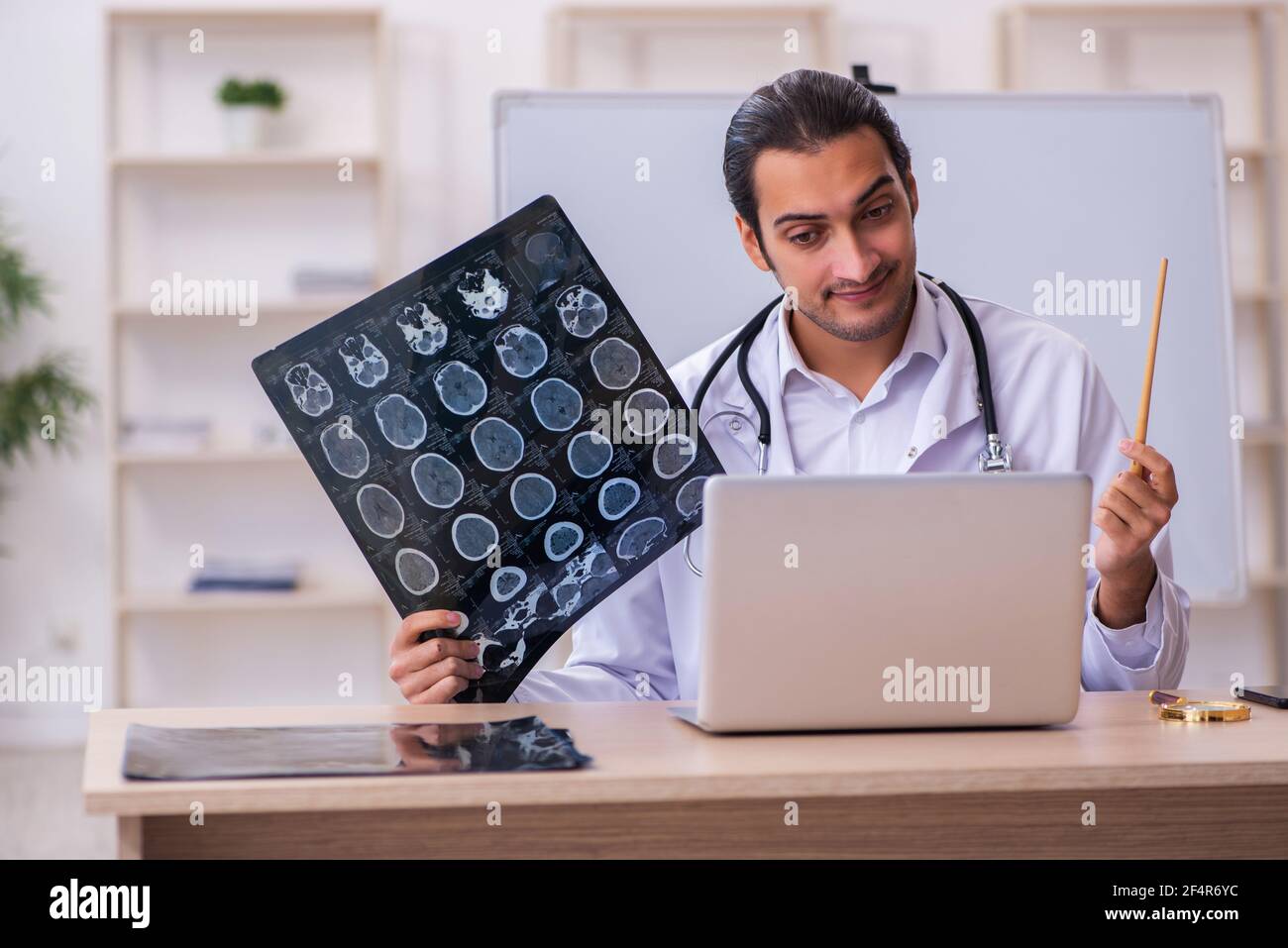 Young doctor radiologist working in the clinic Stock Photo - Alamy