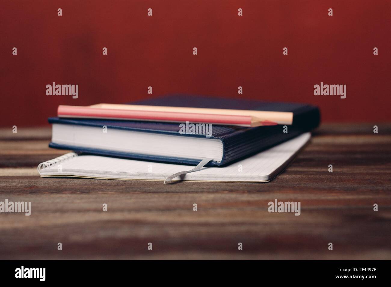 book with notepad pencils office documents object on wooden table Stock ...
