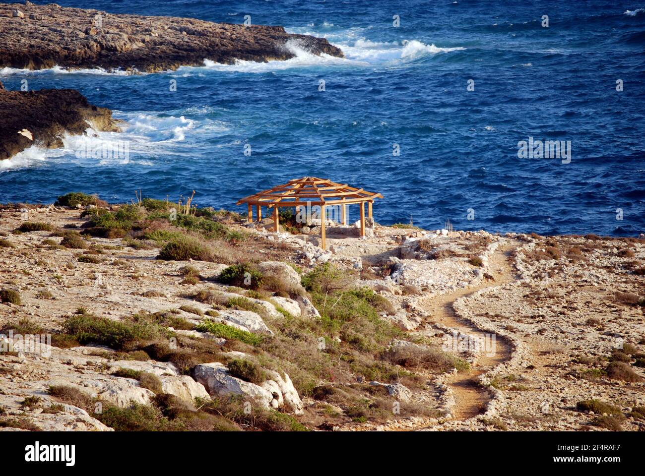 Land, sea and man-made harbour for sunset appetizers Stock Photo - Alamy