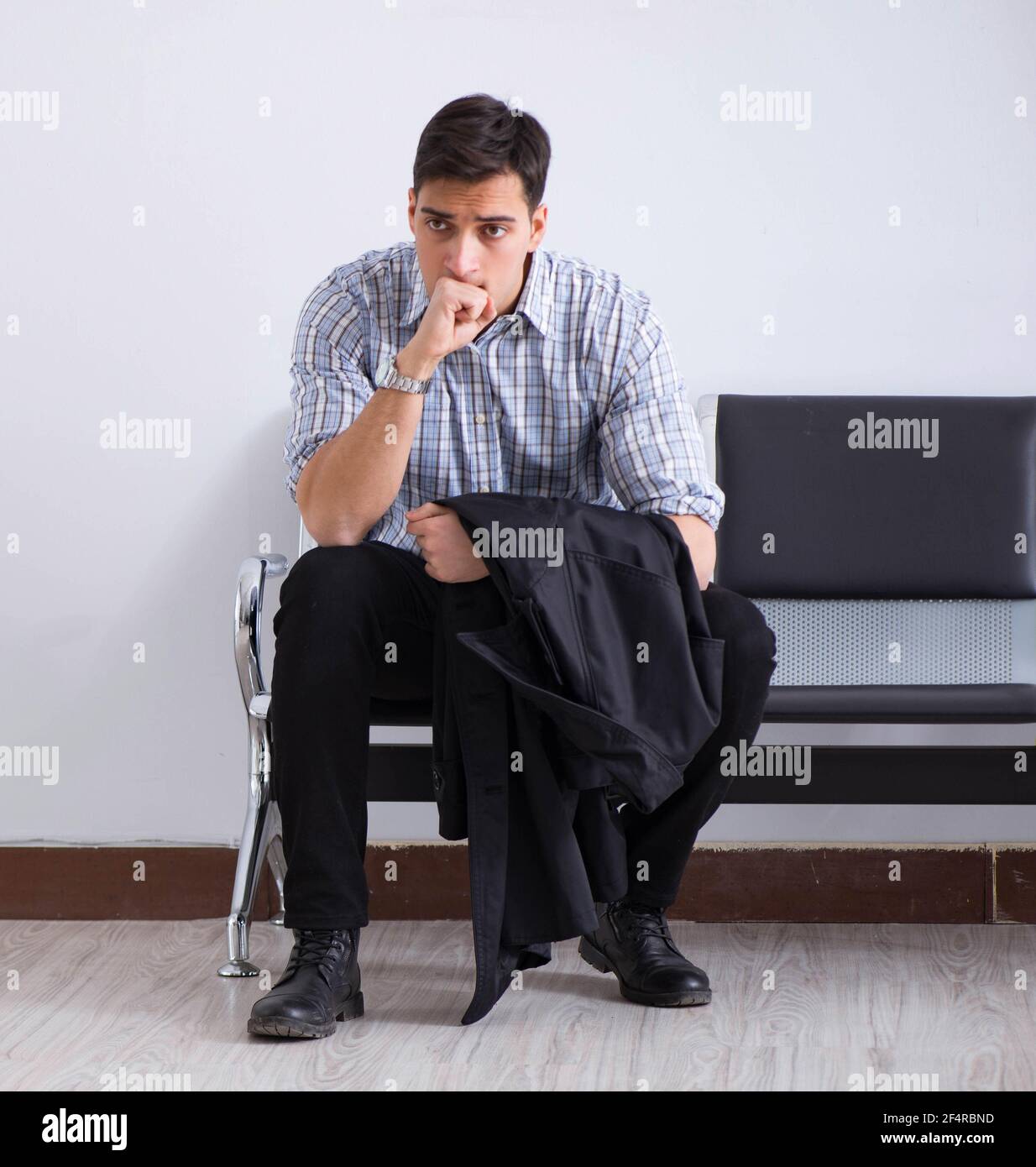 The man nervously impatiently waiting in the lobby Stock Photo - Alamy