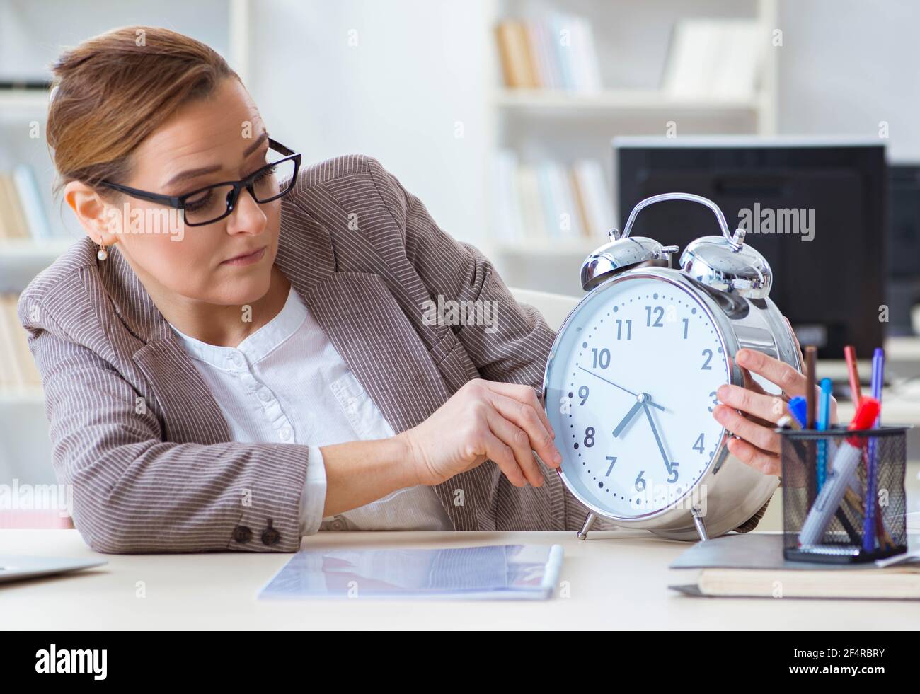 The businesswoman workaholic trying to finish urgent paperwork Stock ...