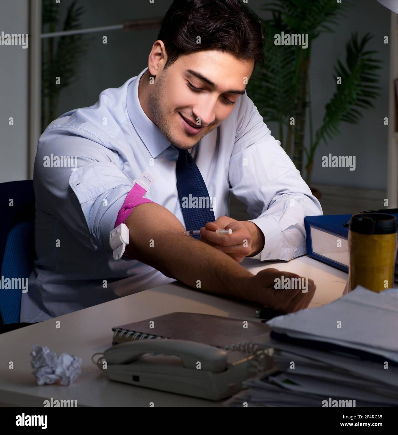 The employee relieving stress from overtime with drugs narcotics Stock ...