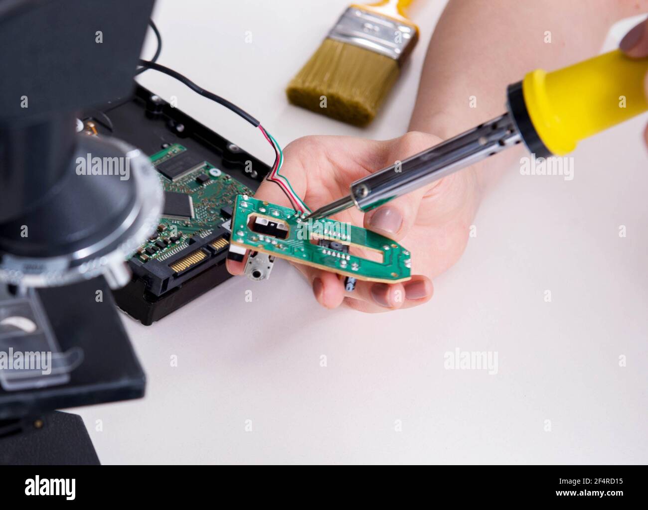 The engineer fixing broken computer hard drive Stock Photo - Alamy