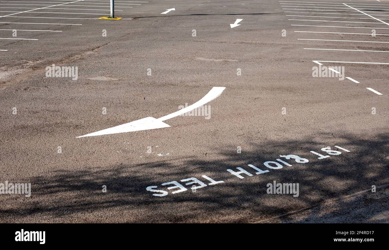 Large white arrow in a car park Stock Photo - Alamy