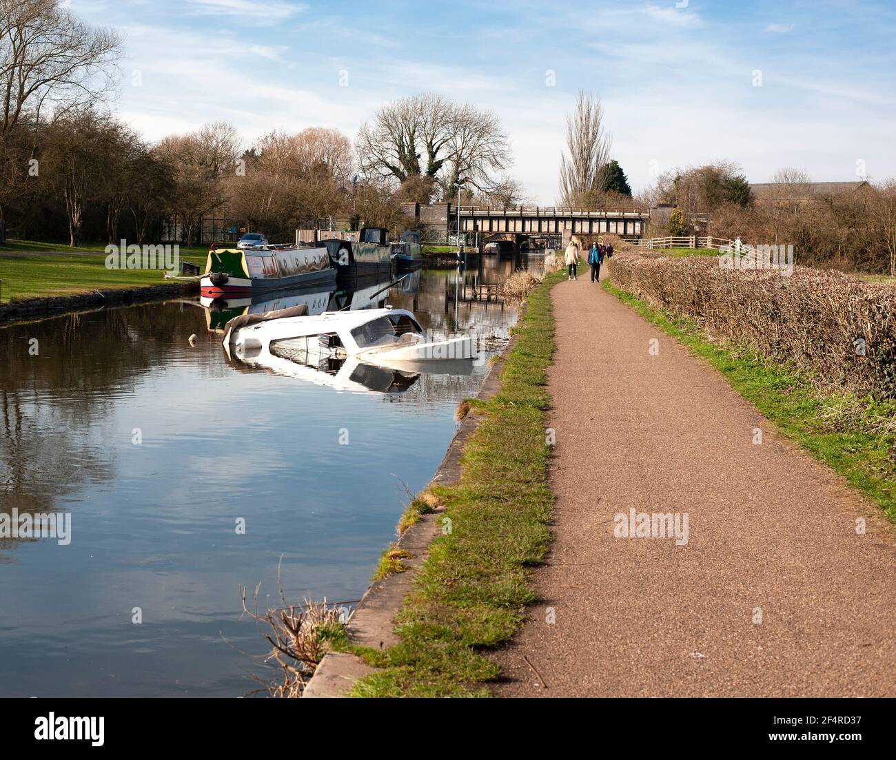 Small cabin cruiser sinking in a canal Stock Photo - Alamy
