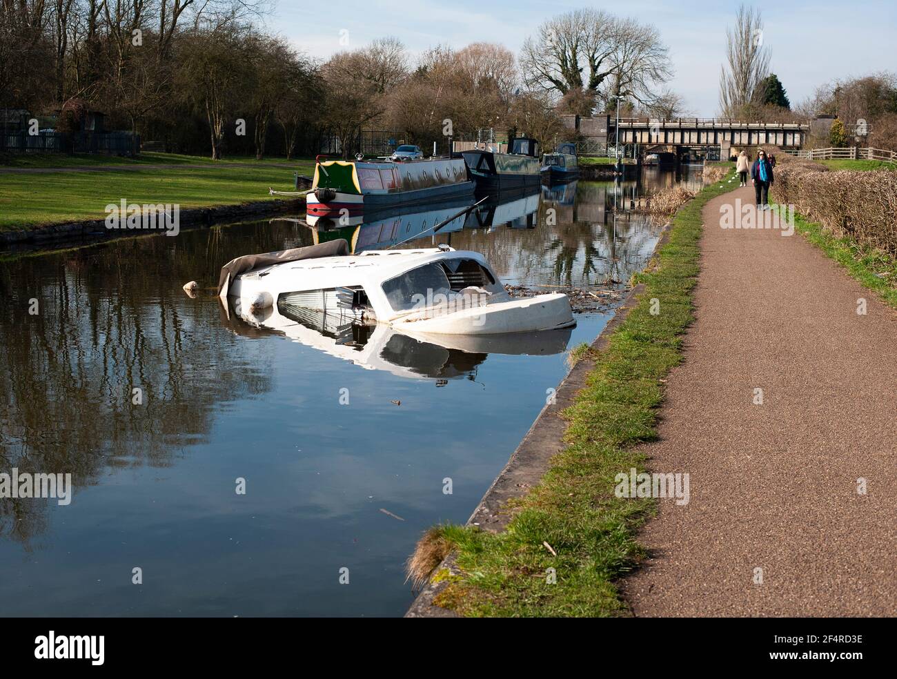 Small cabin cruiser sinking in a canal Stock Photo - Alamy