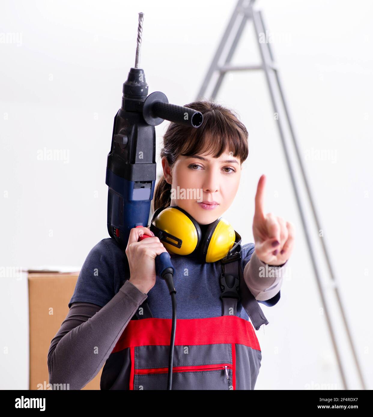Woman noise drill hi-res stock photography and images - Alamy