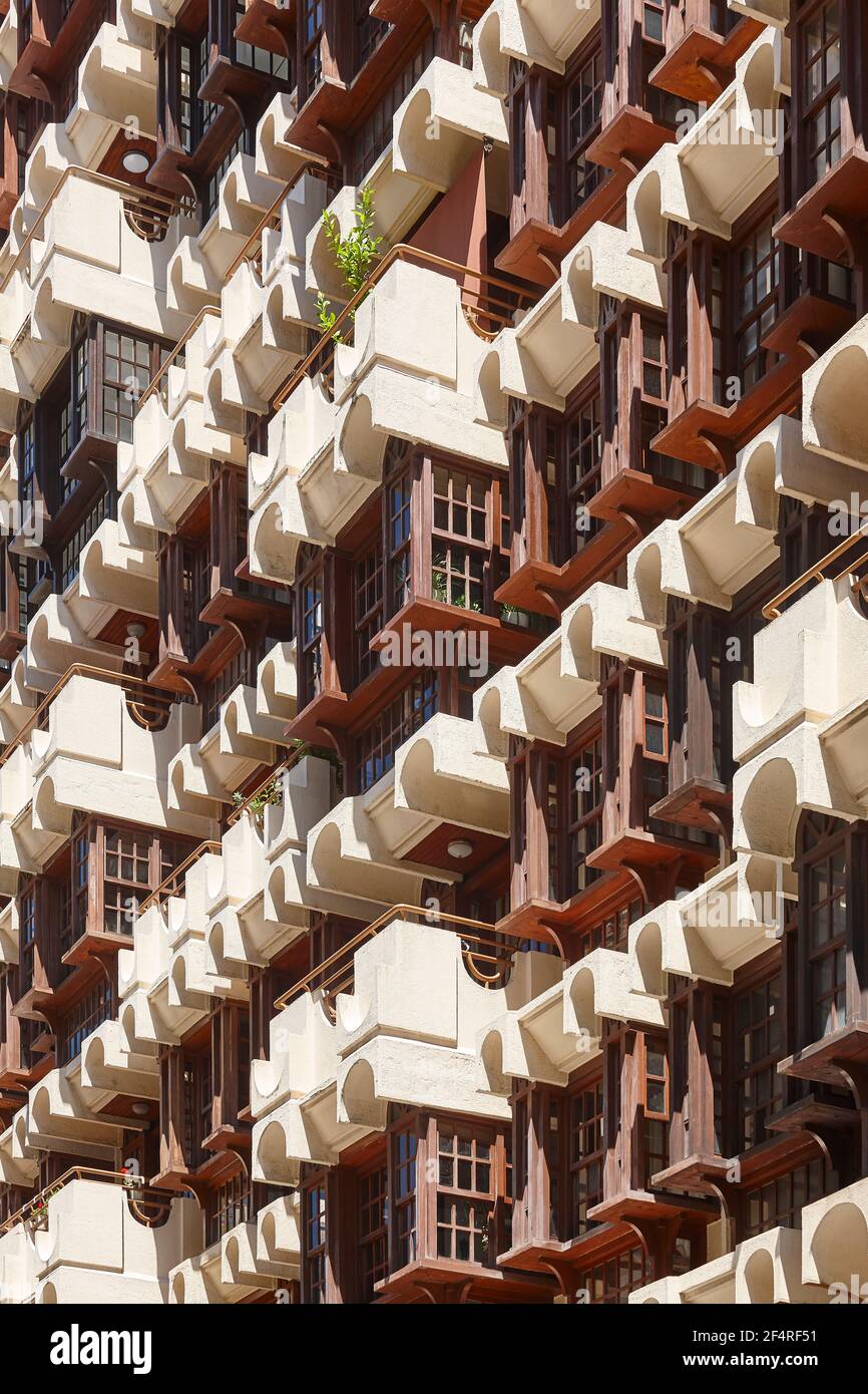 Geometric picturesque building facade in concrete and wood ...