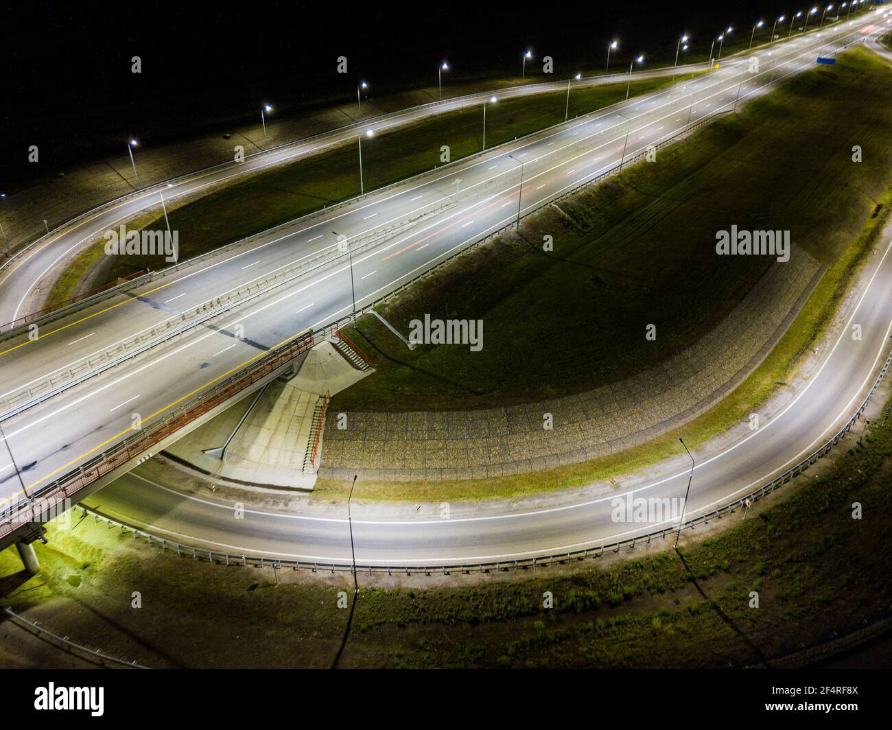 Night roads panoramic background, bird eye view on illuminated highway ...