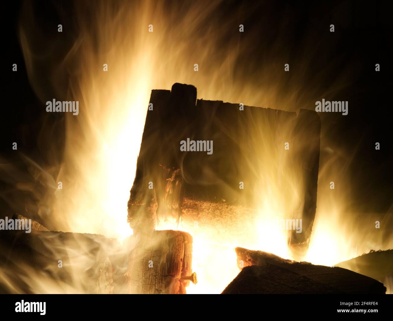 Long exposure shot of a fiery bonfire burning crates of wood Stock ...