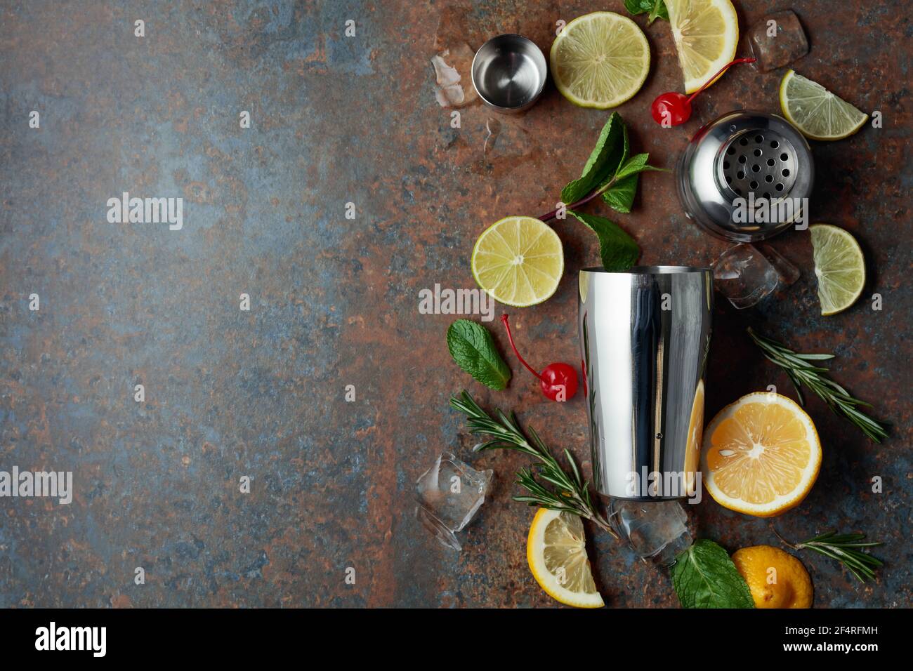 Shaker with ingredients for making cocktails. Rusty metal background ...