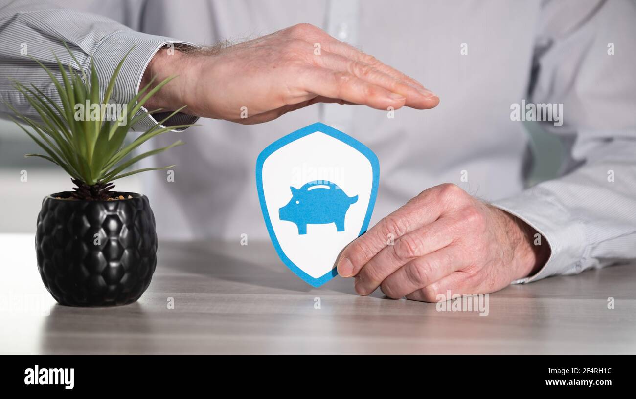 Concept of money protection with paper shield protected by male hand ...