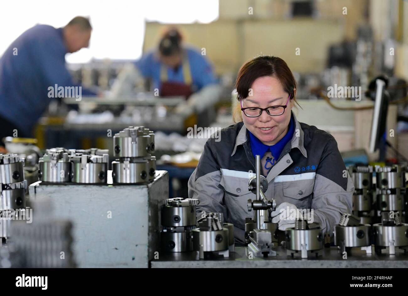 HOHHOT, CHINA - MARCH 23, 2021 - A worker checks the quality of a chuck ...