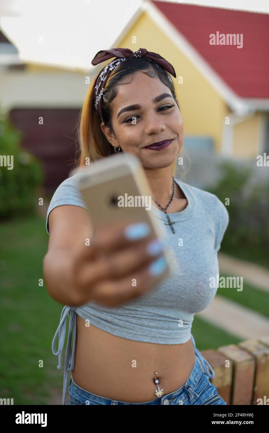 Woman taking a selfie with her mobile phone Stock Photo - Alamy