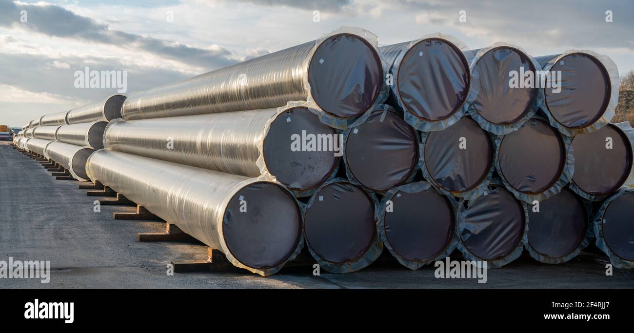 A stack of pipes on the construction site of a gas pipeline that will ...