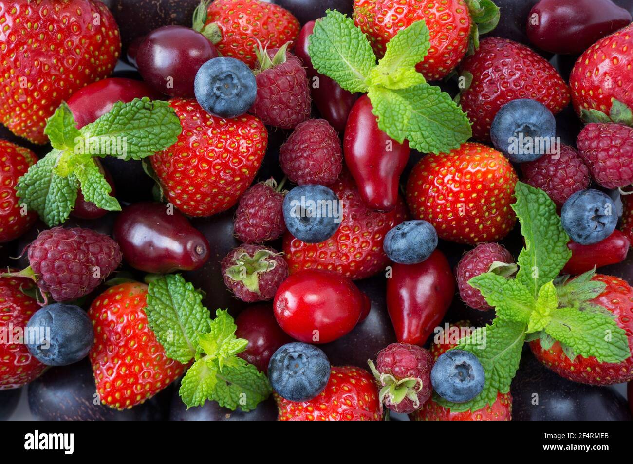 Various fresh summer berries and fruits. Ripe strawberries, raspberries ...