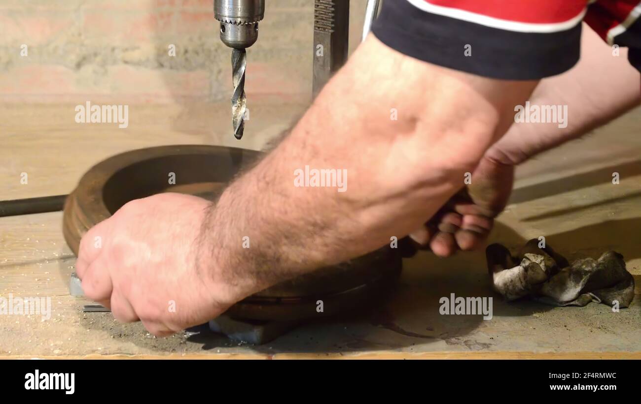 Using drill tool for drilling steel Stock Photo - Alamy