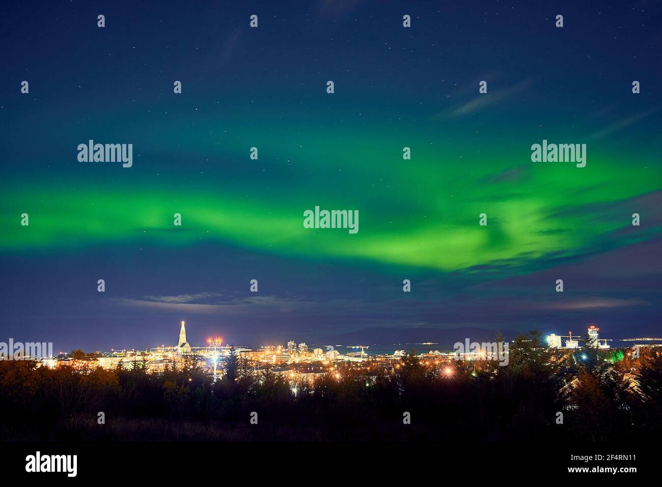 northern lights above Reykjavik in Iceland at night Stock Photo - Alamy