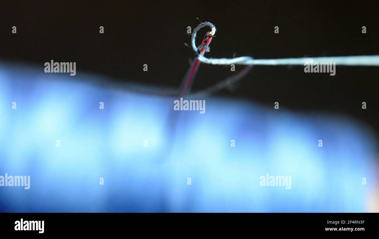 Threading through a needle hi-res stock photography and images - Alamy