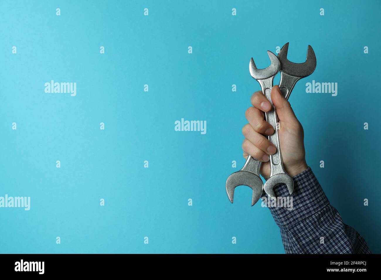 Hand with wrenches hi-res stock photography and images - Alamy